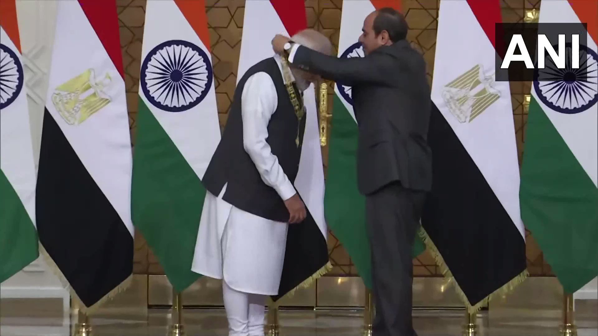 ANI on Twitter: "#WATCH | Egyptian President Abdel Fattah al-Sisi confers PM Narendra Modi with ...