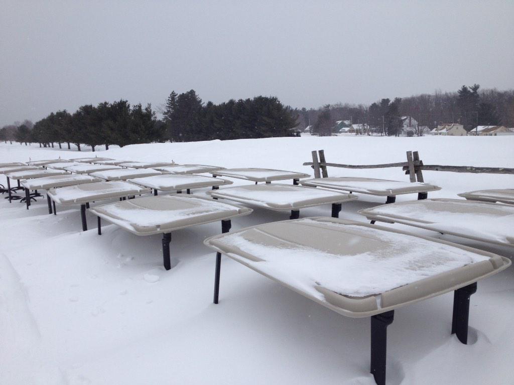 Check out all these tables lined up in a snow-covered field : r/weather