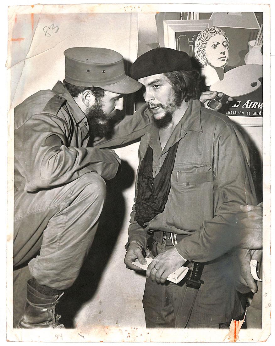 Fidel Castro confers with Che Guevara in Cuba. Original 1959 print from ...