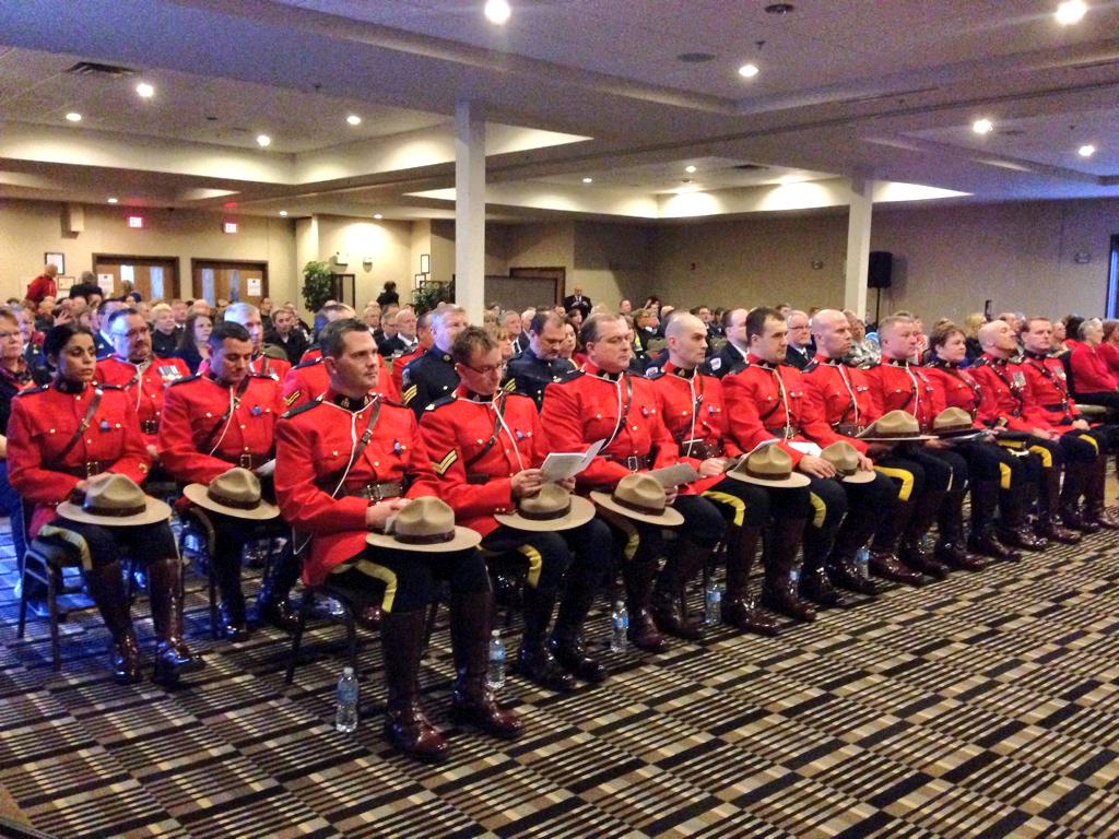RCMP officers and other first responders seated at service in ...