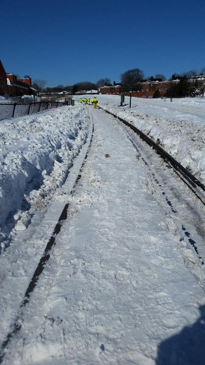 Crews continue to clear RedLine tracks of snow & ice near JFK MAsnow ...