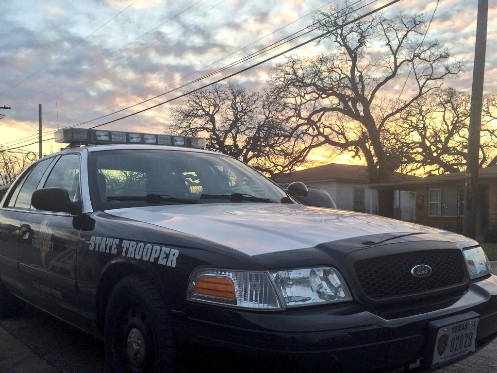 .TxDPS squad car parked outside Erath county courthouse as sun rises ...