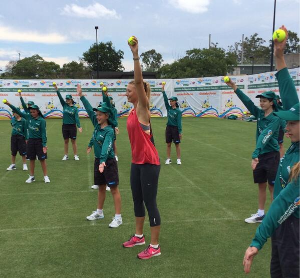 Sharapova hits the practice courts and met ball kids