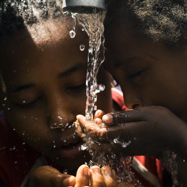 Poor Kid Drinking Water