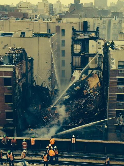 New York firefighters remain at scene of building blast - ITV News