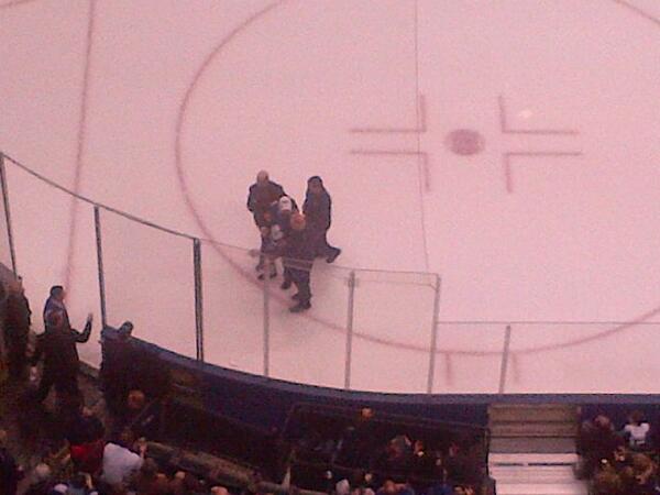 Video: Fan Runs, Then Falls On The Ice During Hockey Game | Talking Baws