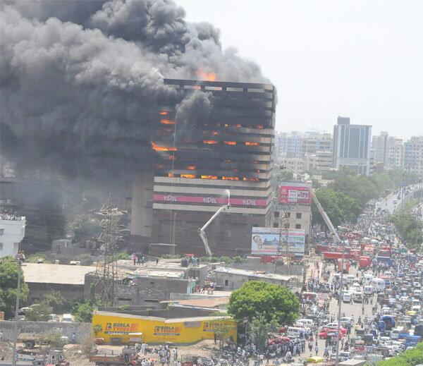 Surat: Massive fire in Orchid tower, brigade call declared | DeshGujarat
