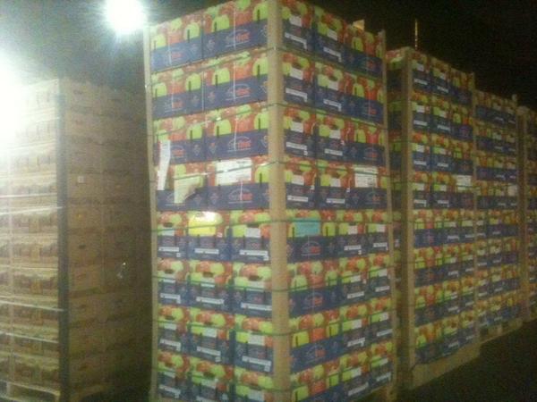 : Pallets and boxes of fresh fruit arriving at the #Oakland Produce M...