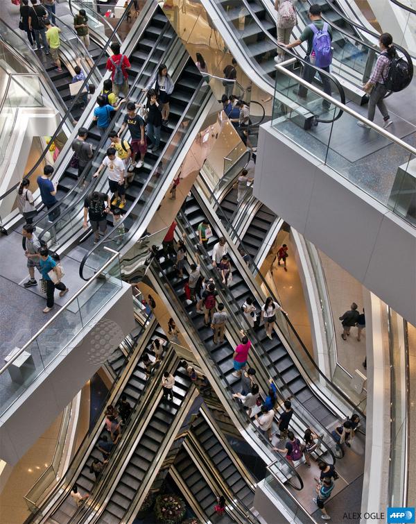 Like an Escher maze - escalators in Hong Kong shopping mall AFPphoto | alex ogle | Scoopnest