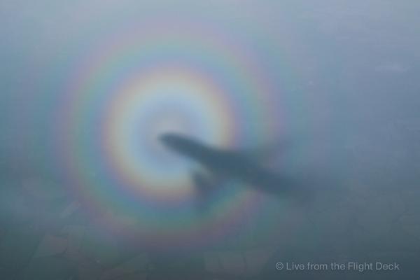 Glory : Pilot Glory optical phenomenon positioned sun refracting water ...