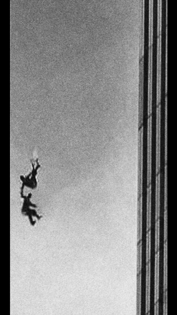 Two People Holding Hands As They Fall From The Twin Towers