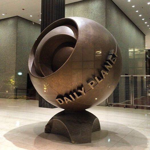 Daily Planet Globe Logo