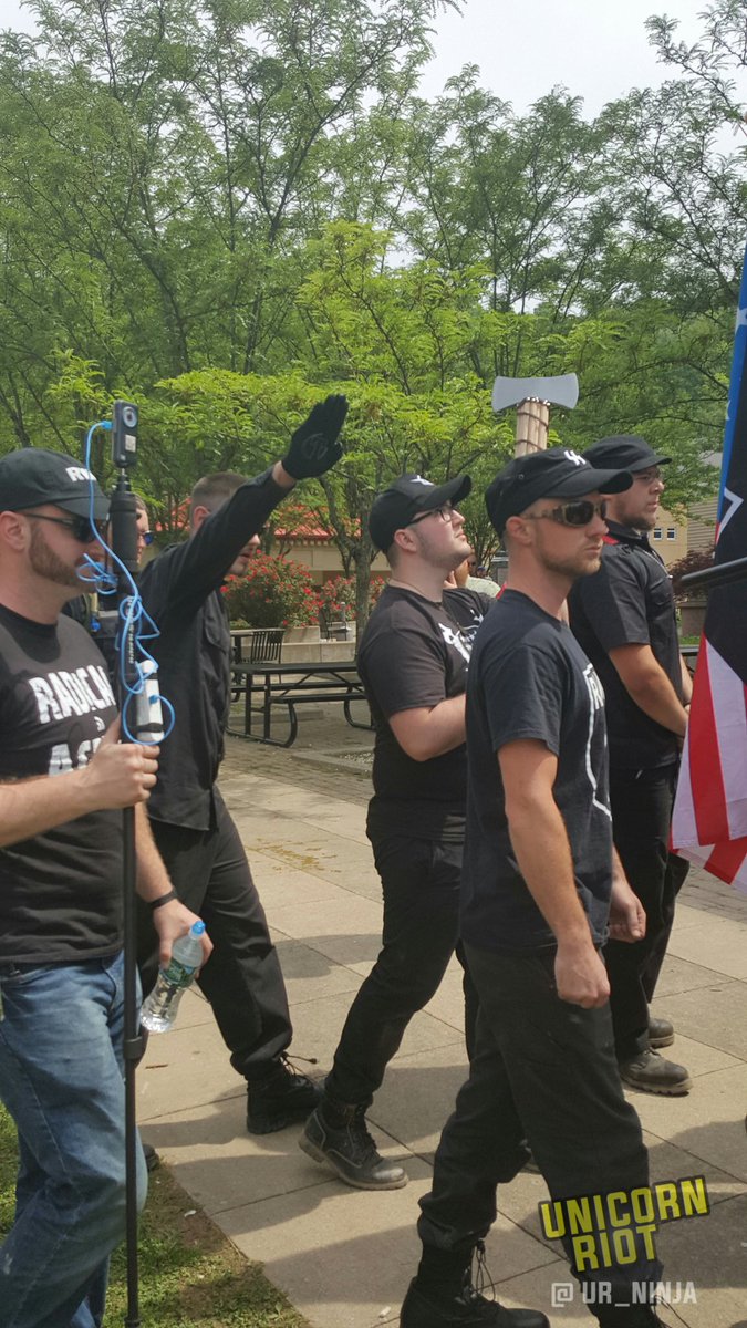 Open sieg heil gestures and "88" patch (stands for the 8th letter of ...