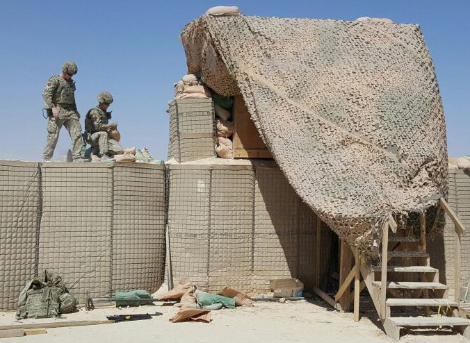 Sappers from the Royal Engineers construct a fortified sentry position ...