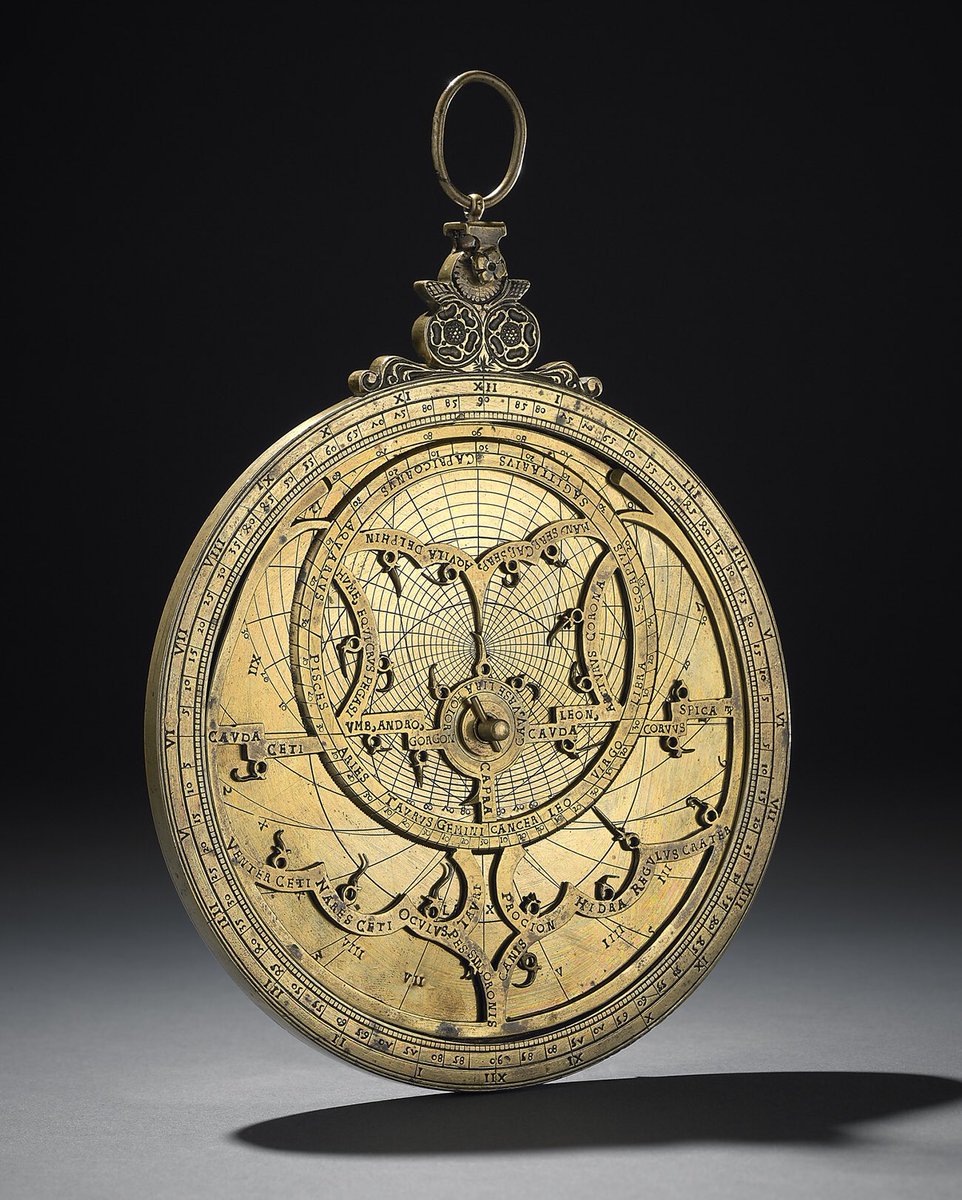 This exquisite brass instrument is an astrolabe, a portable model of ...