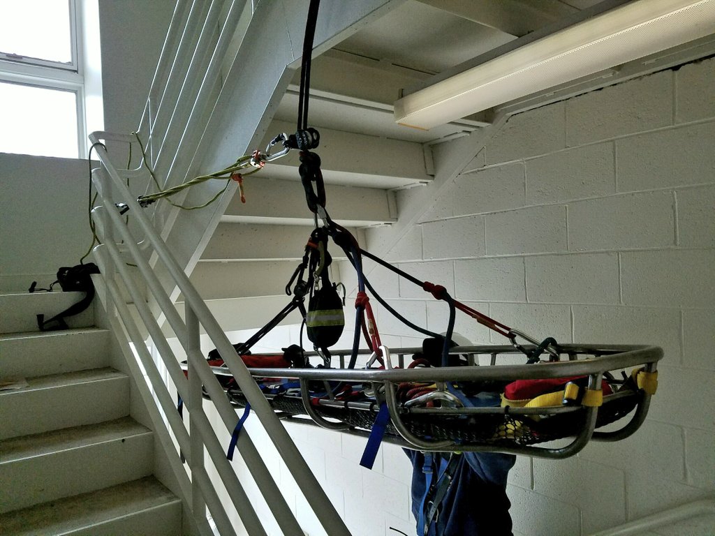 Members of rescue squad 2 drilling with arizona vortex, lowering victim ...