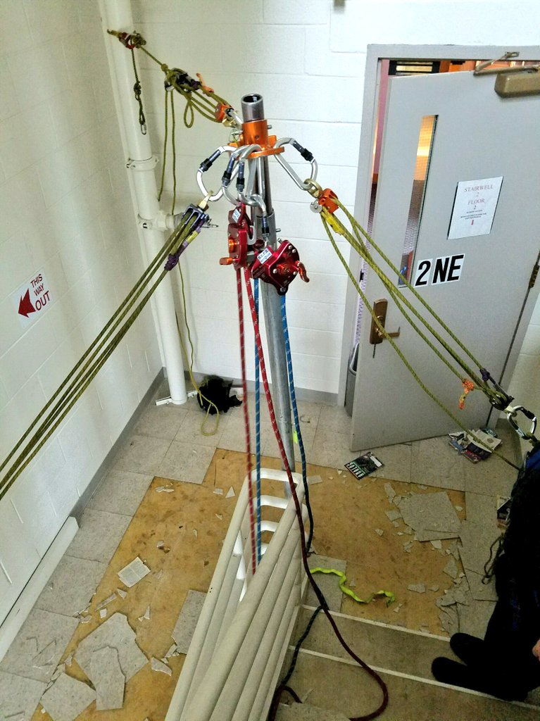 Members of rescue squad 2 drilling with arizona vortex, lowering victim ...