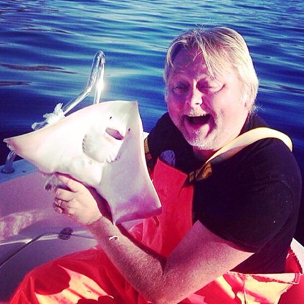 Smiling Stingray And Man