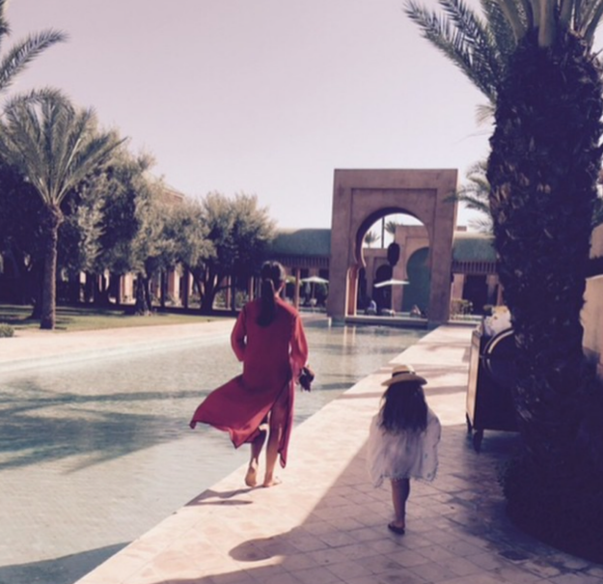 Victoria and Harper Beckham are a super fashionable duo by the pool in ...