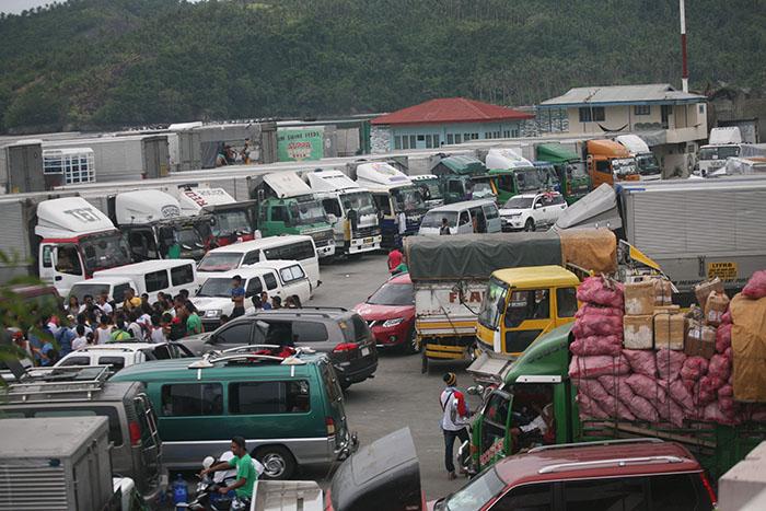Trucks, buses and other land vehicles are stranded at the matnog port ...