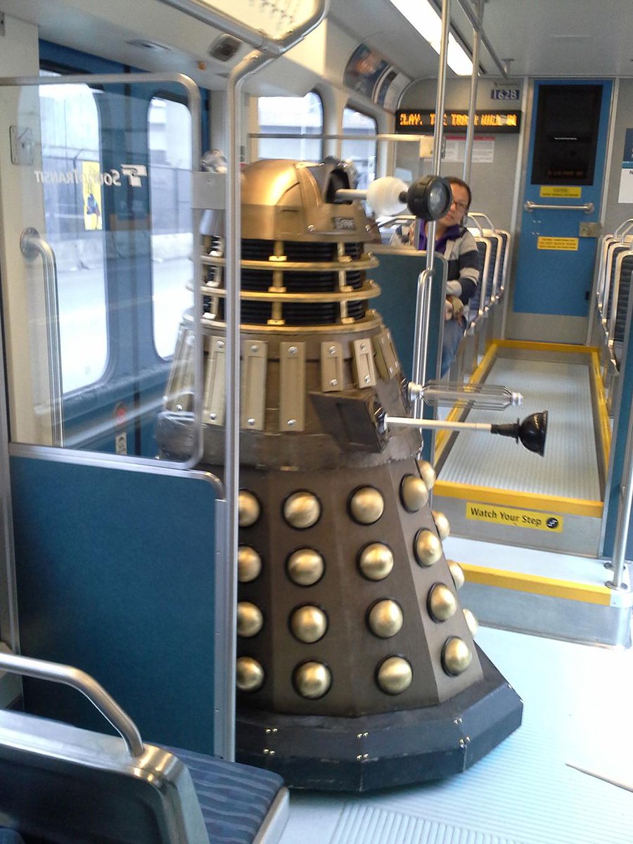 A couple of Daleks try to board a London Transport Routemaster at ...