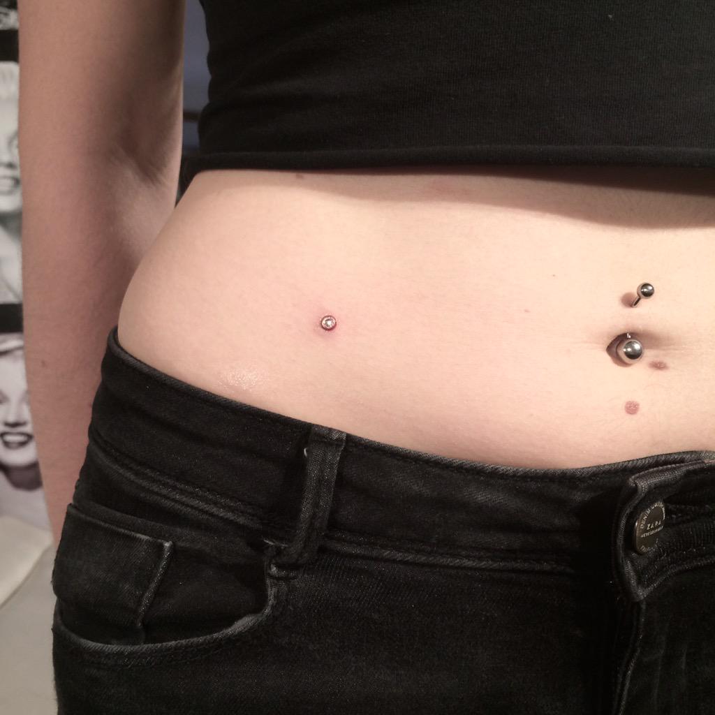 Dermal Piercing Hip With Tattoo