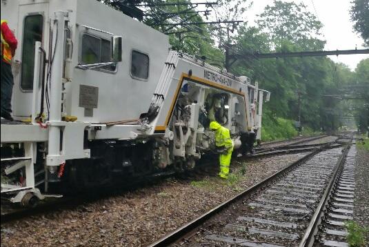 MBTA Crews operate a Metro Tamper as Right of Way maintenance continues ...