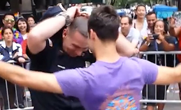 New York policeman entertains crowd with dance at Gay Pride parade ...