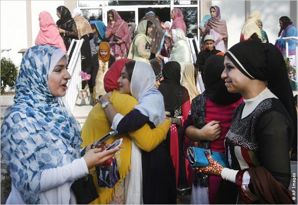 Women exchange greetings after Eid al-Fitr services the Masjid Darul ...