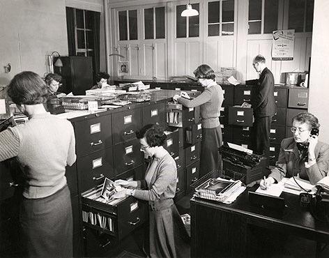 1960s offices — typewriters, papers, file cabinets and well dressed ...