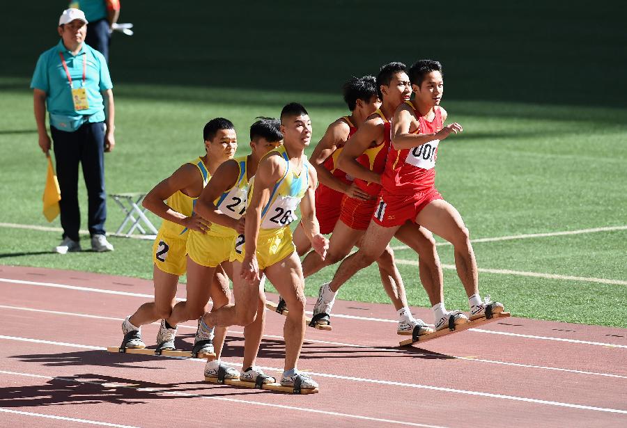 Chinese: Board-shoe racing, a traditional sport at Chinese ethnic games ...