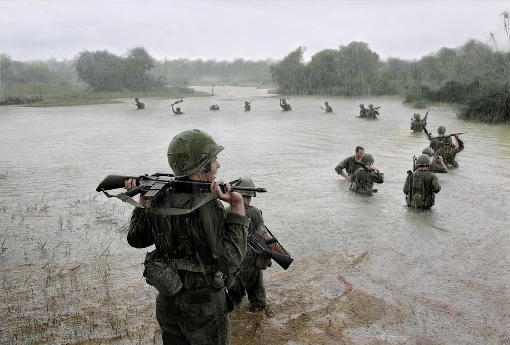 U.S. paratroopers crossing a river in southern Vietnam, 1965. Photo by ...