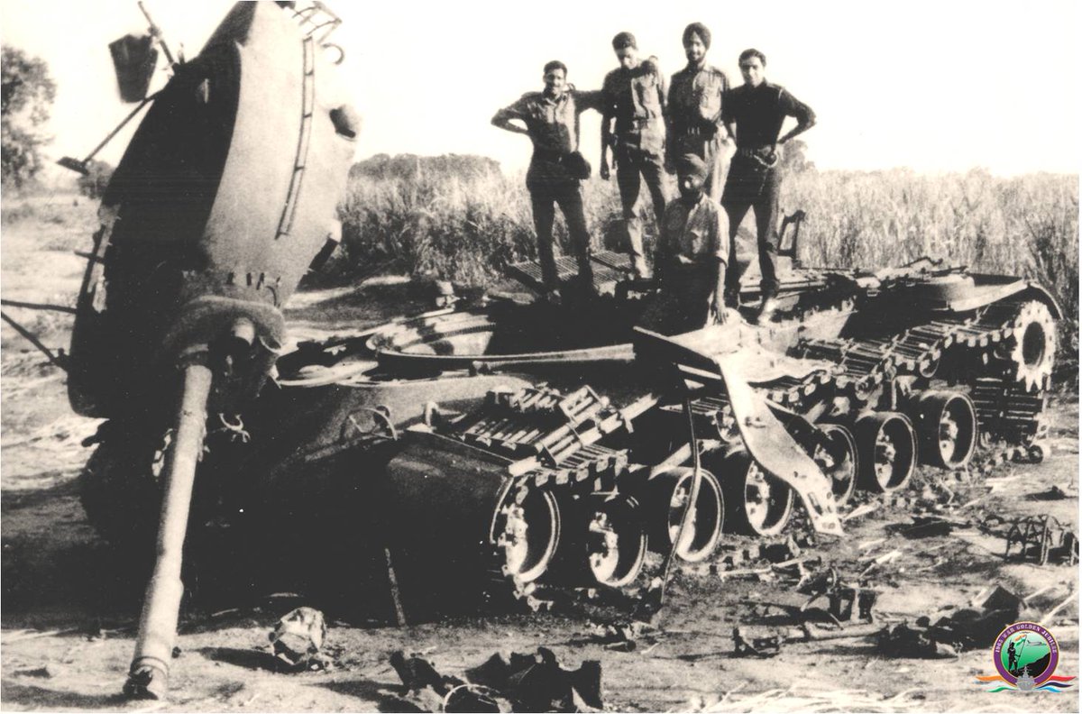 Indian soldiers standing on a destroyed Pakistani Patton tank after the ...