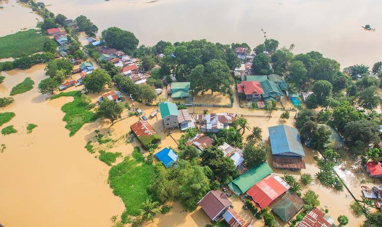 Aerial drop off of relief goods on roofs of submerged homes in calumpit ...