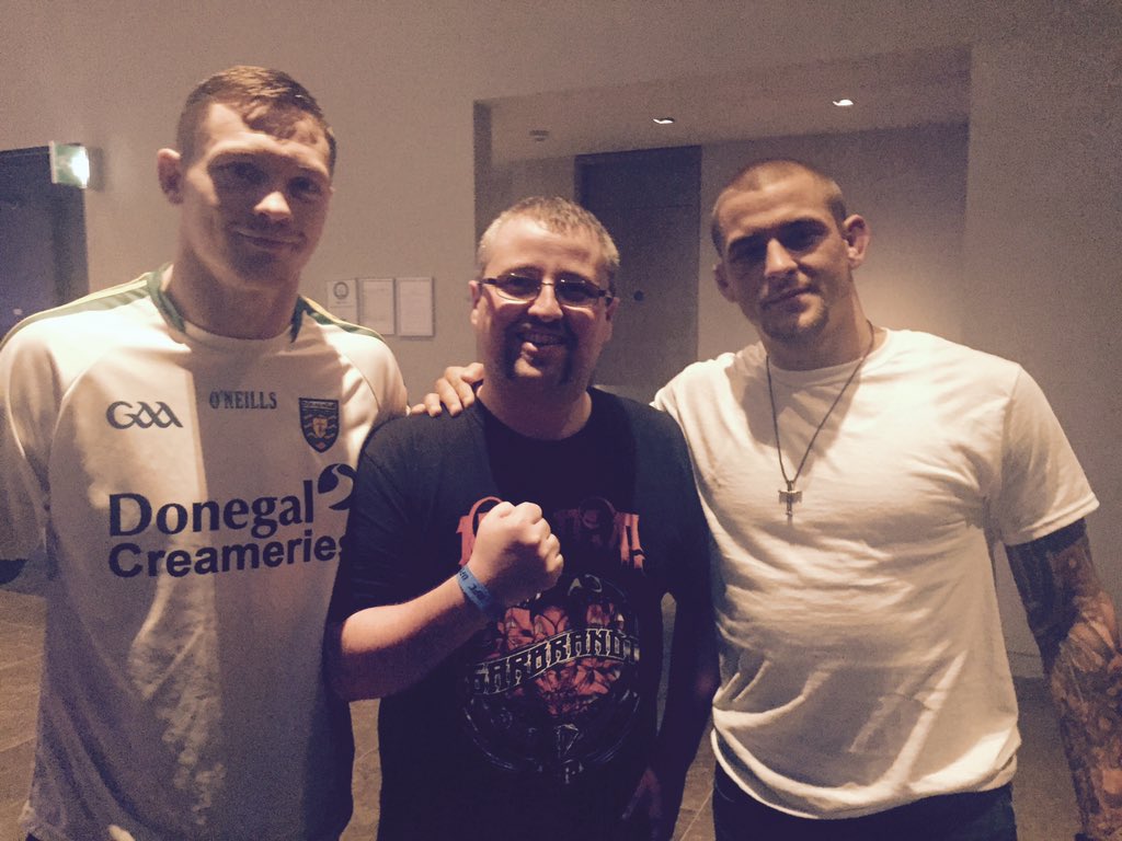 Joe Duffy and Dustin Poirier taking pictures together with fans right ...