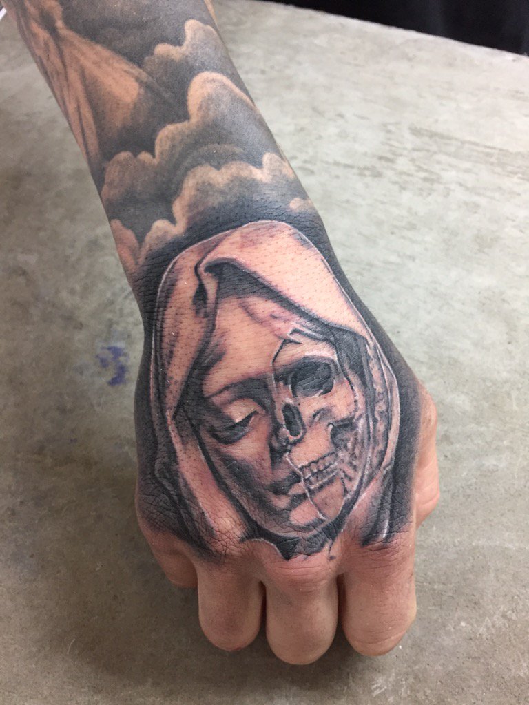 Skeleton Face Hand Tattoo