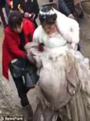 Unlucky bride's wedding dress is totally ruined as rain wrecks her big ...
