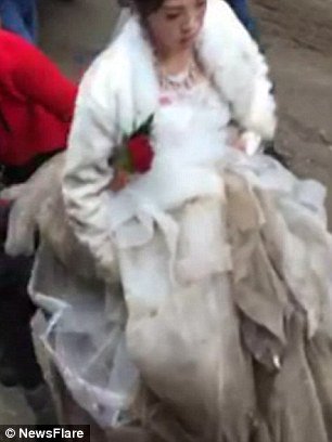 Unlucky bride's wedding dress is totally ruined as rain wrecks her big ...