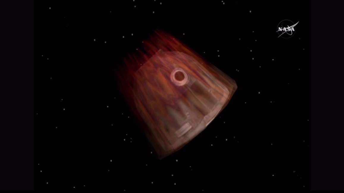 Soyuz descent module carrying crew entering atmosphere. Heat shield ...