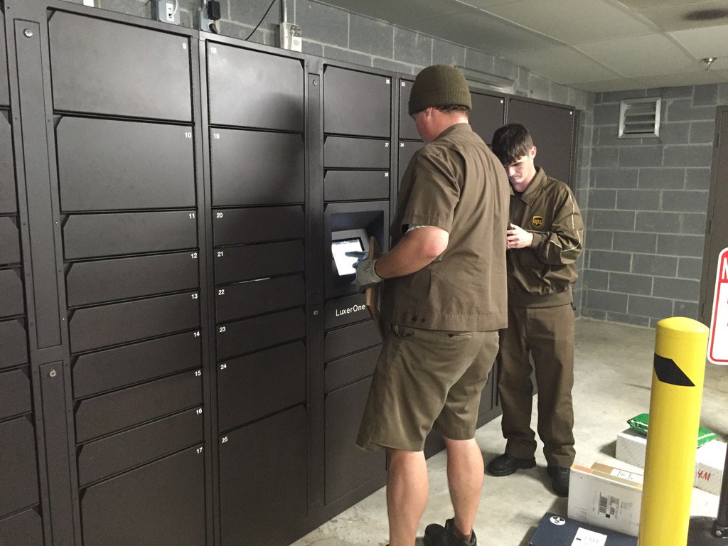 UPS guys using a high tech package locker system at apartment complex ...