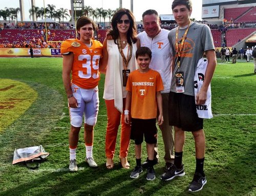 Butch jones celebrates with his family after the game outback bowl ...