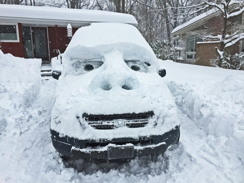 Sculpted snow face on car brings smiles to those slammed by blizzard ...