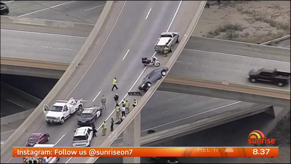 Terrifying images show a car teetering on the edge of an overpass after ...
