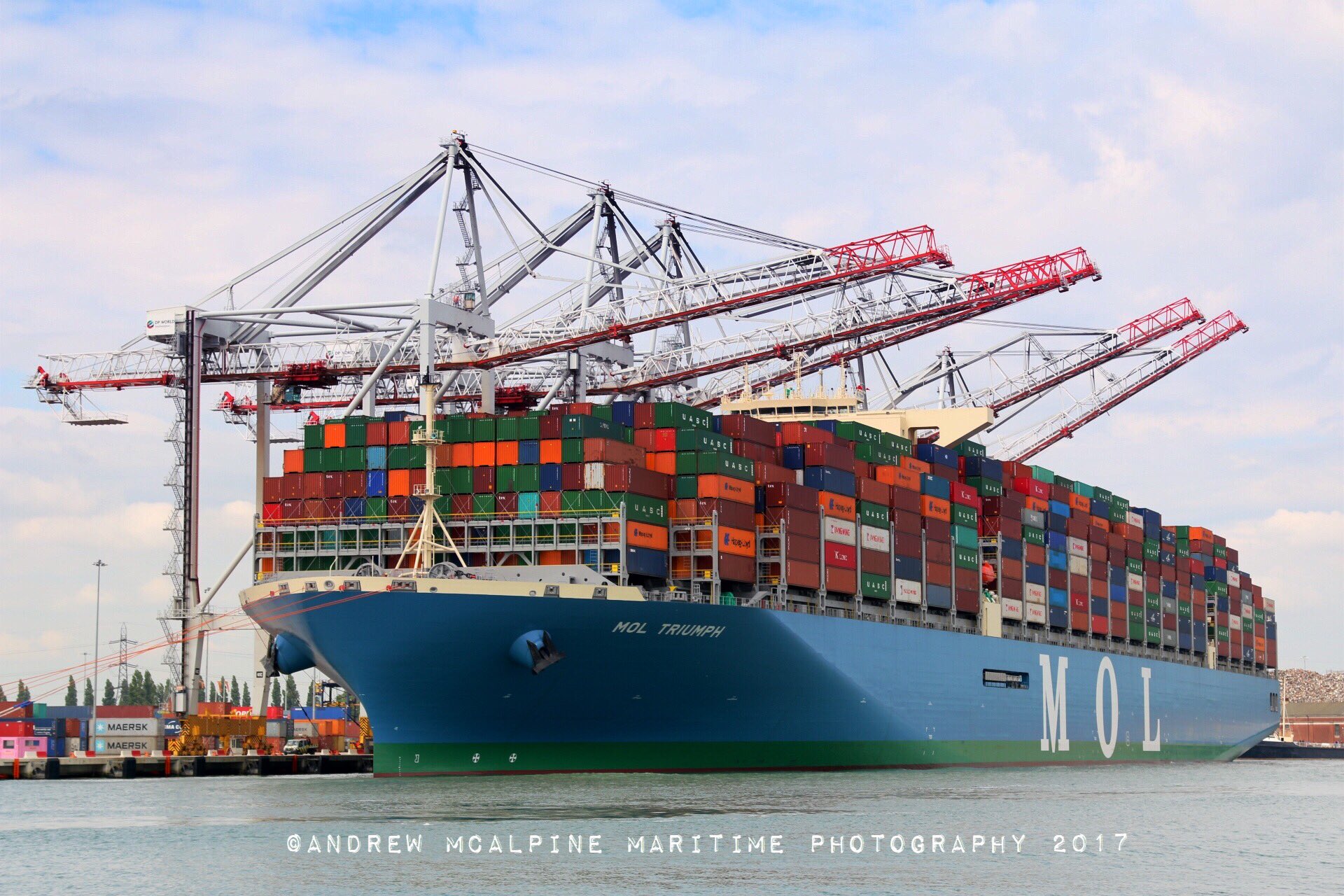 With cranes booming down in unison, MOL Triumph has arrived at DP World ...