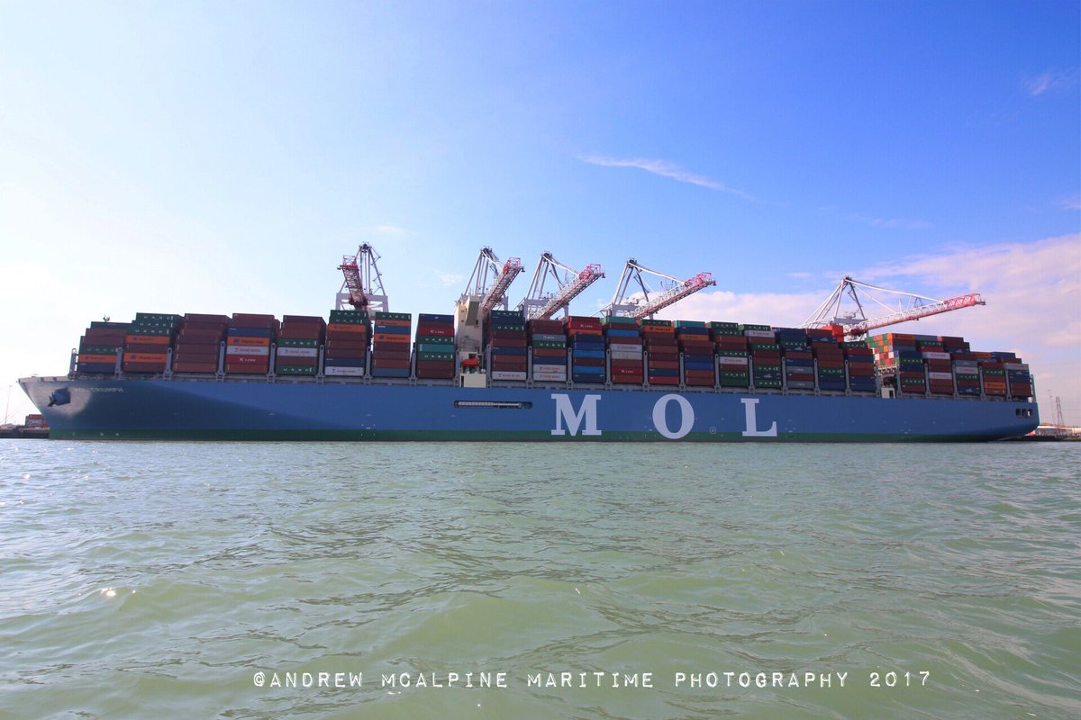 With cranes booming down in unison, MOL Triumph has arrived at DP World ...