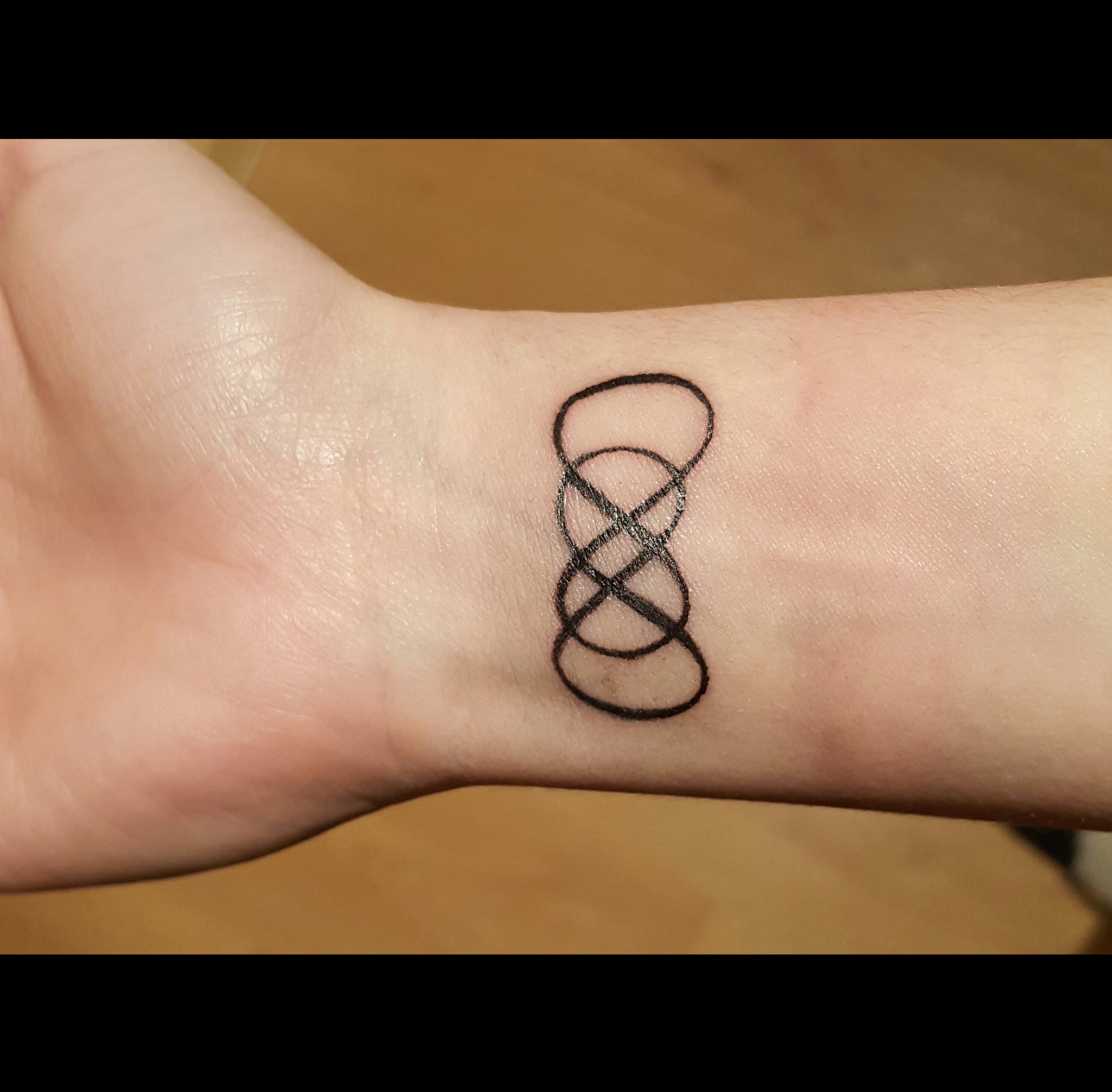 Revenge Symbol Tattoo