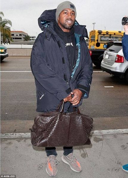 Kanye West: We spotted Kanye West at LAX wearing the new orange stripe ...