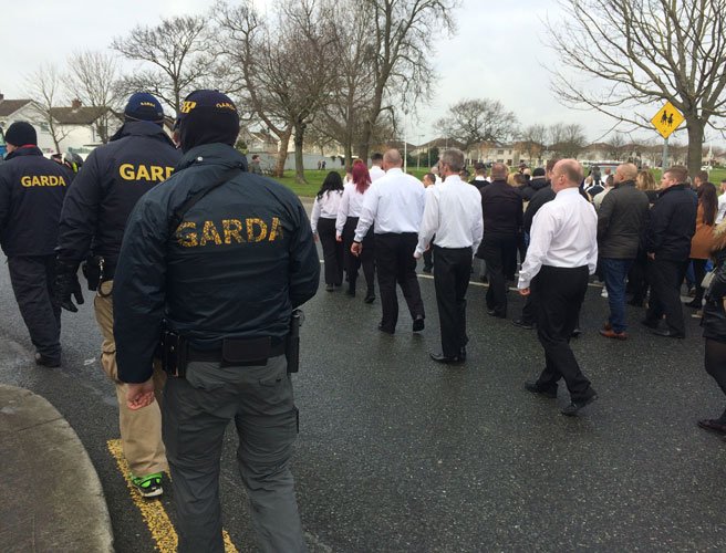 Heavy and armed garda presence as Vinnie Ryan is laid to rest in Dublin ...