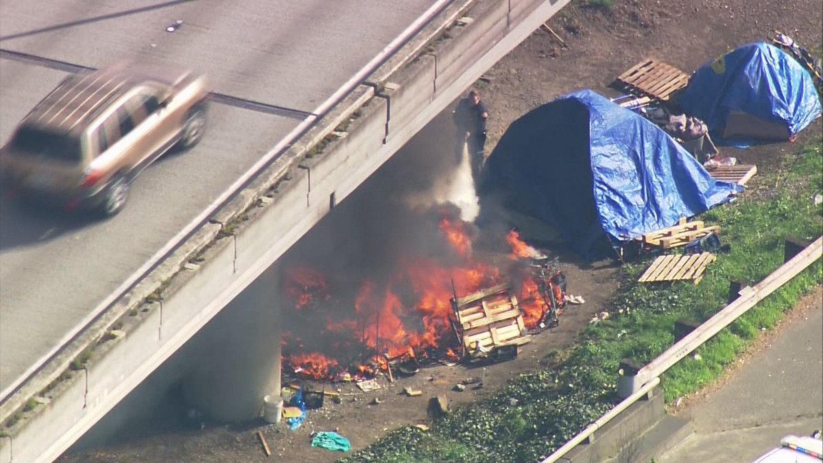 Fire at homeless camp under I-5 at the I-90 interchange in Seattle ...