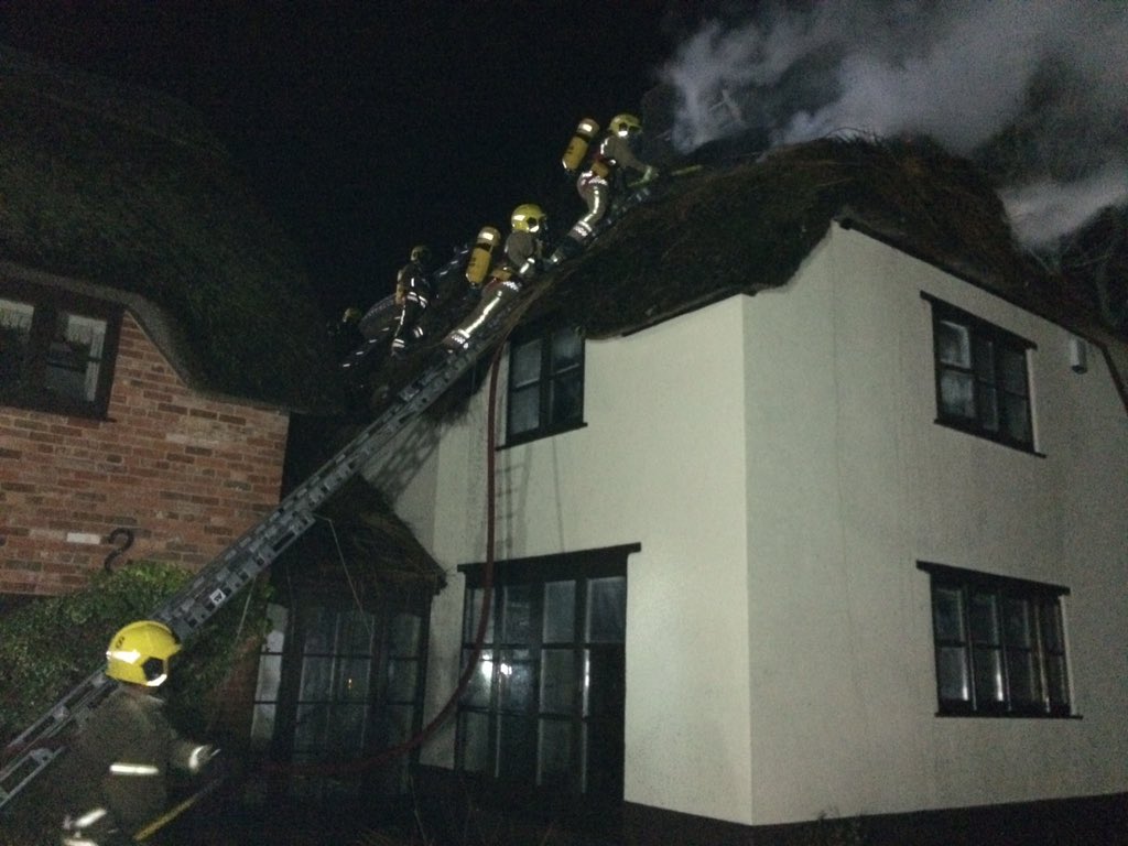 Around 100 firefighters tackle thatched roof blaze - ITV News